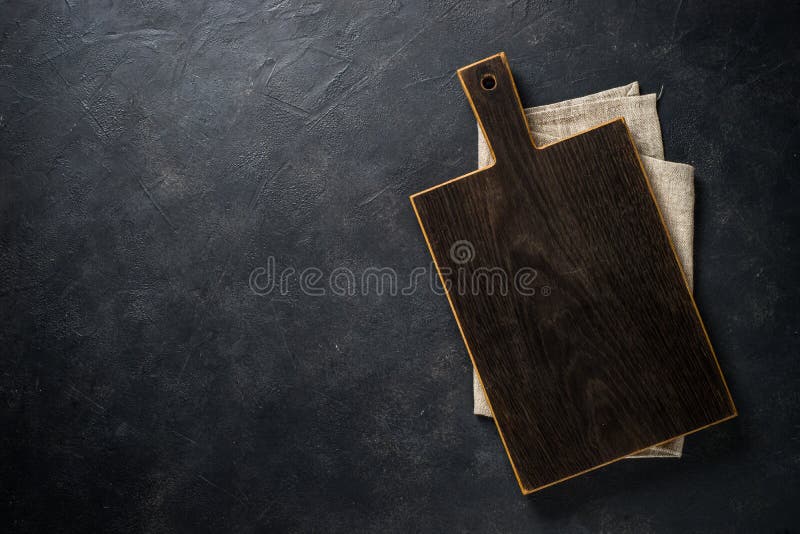 Black Wooden Cutting Board on Black Table. Stock Photo - Image of dark ...