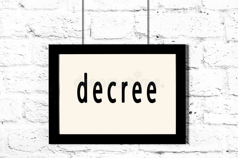 Black Frame Hanging on White Brick Wall with Inscription Decree Stock ...