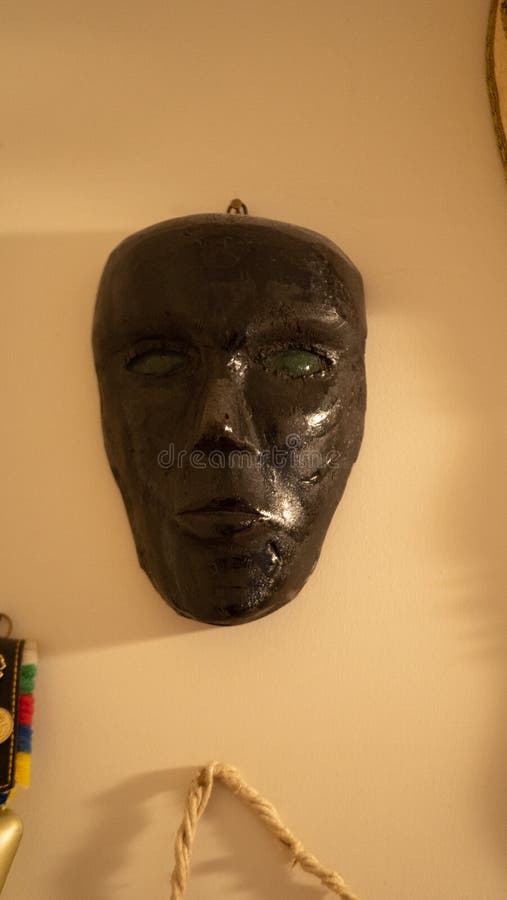 Black Wooden Mask on a Gray Background. Close Up Stock Image - Image of ...