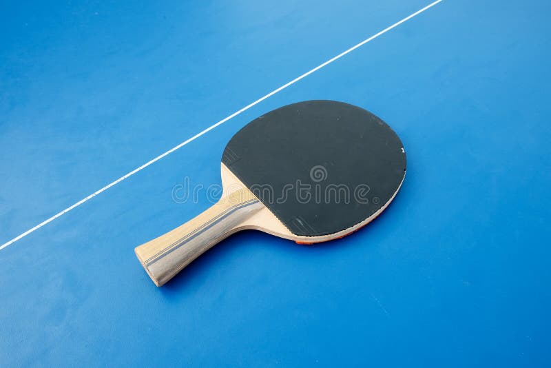 Black Wooden Racket for Ping Pong Lying on the Blue Table Top View ...