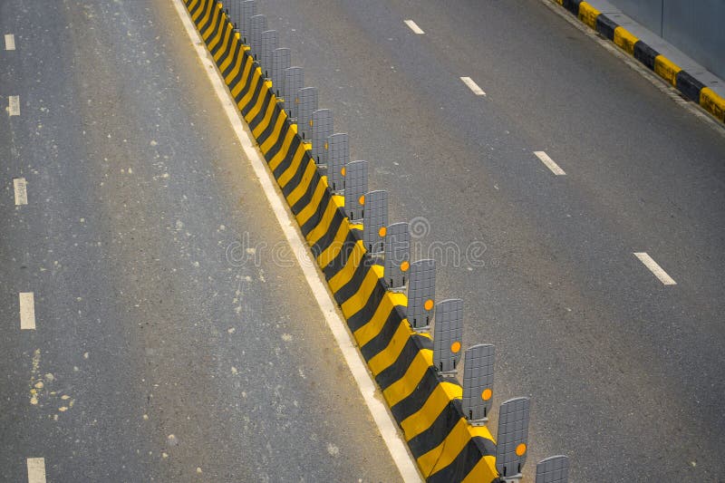 Black and Yellow Barriers Line a Partially Closed Highway, Indicating ...