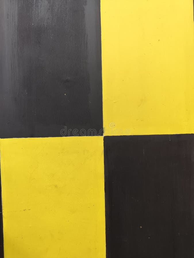 Black and Yellow Checker Pattern Painted on Concrete Wall for Safety ...