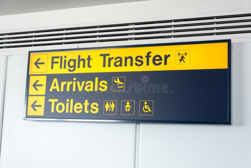 Black and Yellow Flight Transfer, Arrivals and Toilets Sign Stock Photo ...