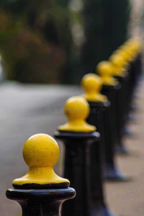 Black and Yellow Metal Barrier Pillars Stock Image - Image of ...