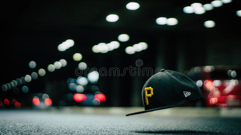 Black and Yellow P Cap Hanging in the Air Stock Image - Image of shadow ...