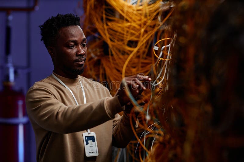 Black Young Man As System Administrator Setting Up Server Network Stock ...