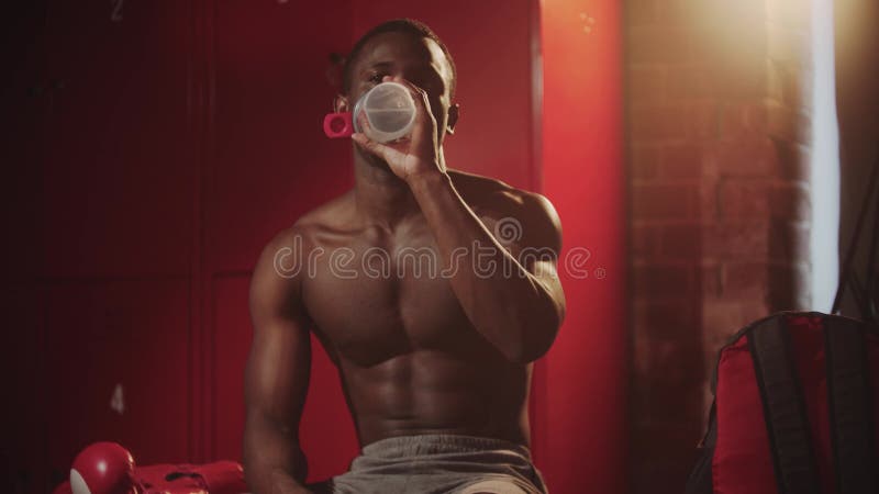 Black Young Man in a Locker Room Wearing Boxers Gloves Stock Video ...