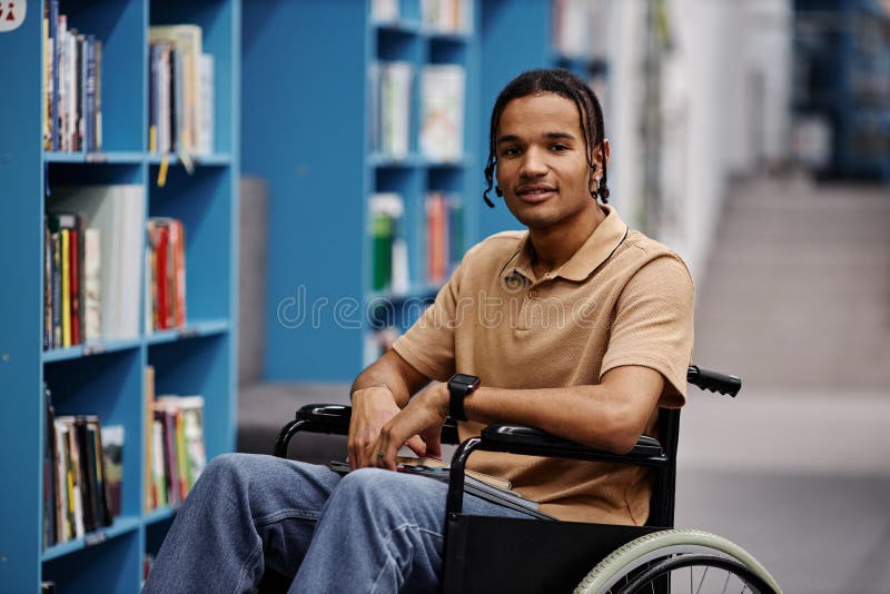 Black Young Man with Disability in Library at Modern College Stock ...