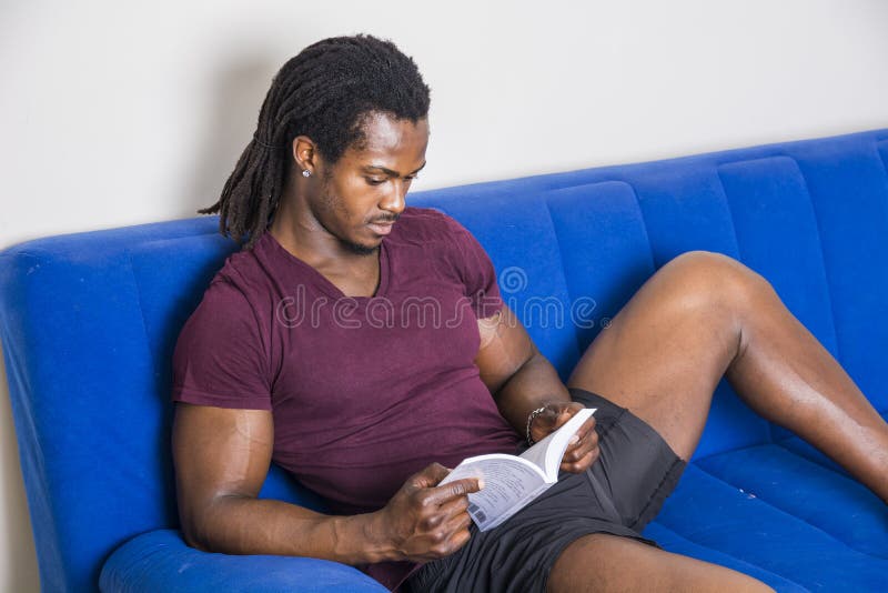 Young Male Bodybuilder Reading Book Sitting Sofa Stock Photos - Free ...