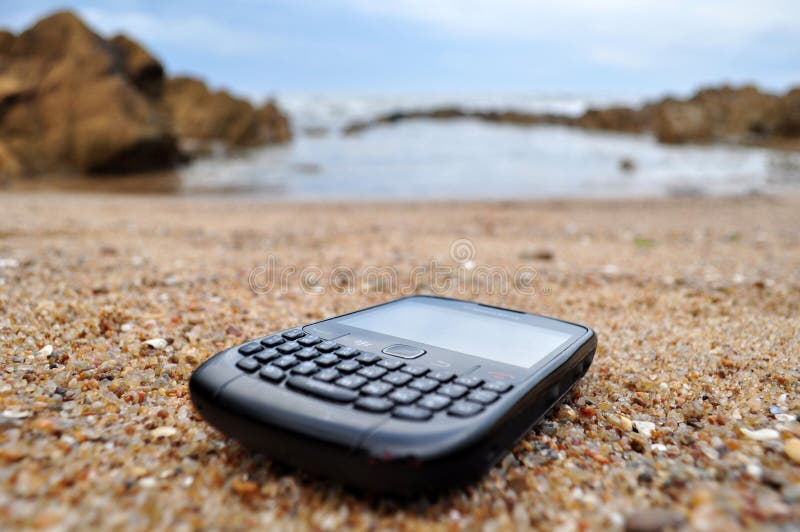 Blackberry Phone on Beach editorial stock image. Image of phone - 131326239