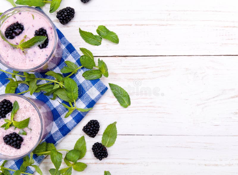 Blackberry Smoothie in a Glass on a White Wooden Table Stock Photo ...
