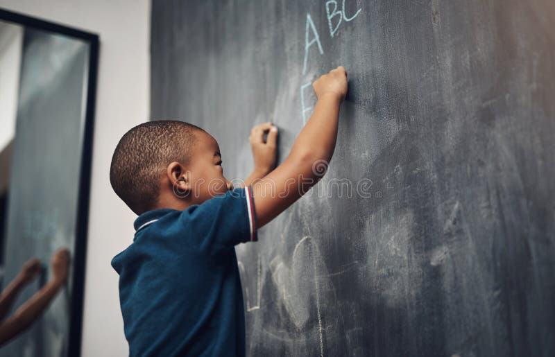 Blackboard, Education and Writing with Boy Student in Classroom of ...