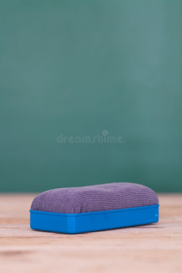 A Blackboard Eraser on the Desk in Front of the Blackboard Stock Image ...