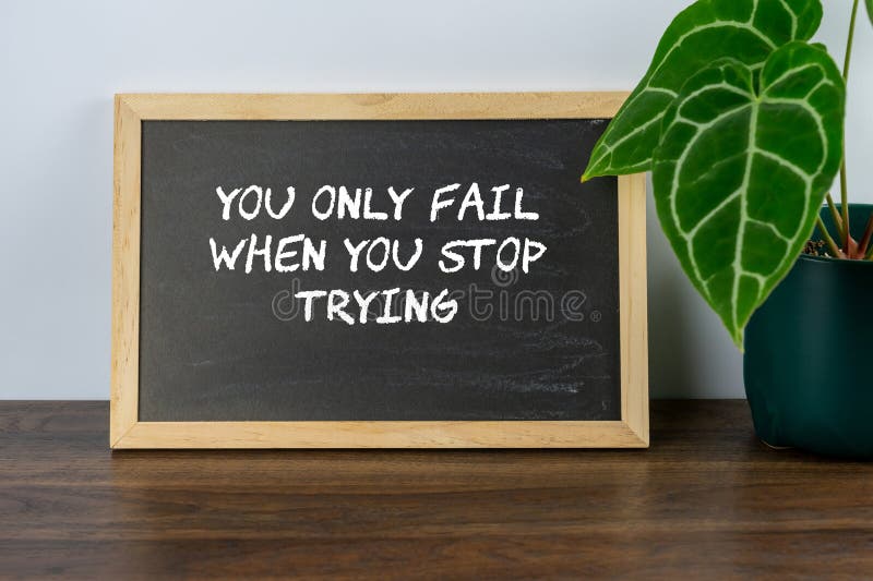 Blackboard with Inspirational Quotes You only Fail when You Stop Trying ...