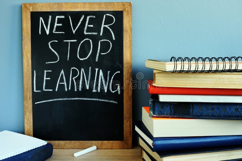 Blackboard with Never Stop Learning and Books. Stock Photo - Image of ...