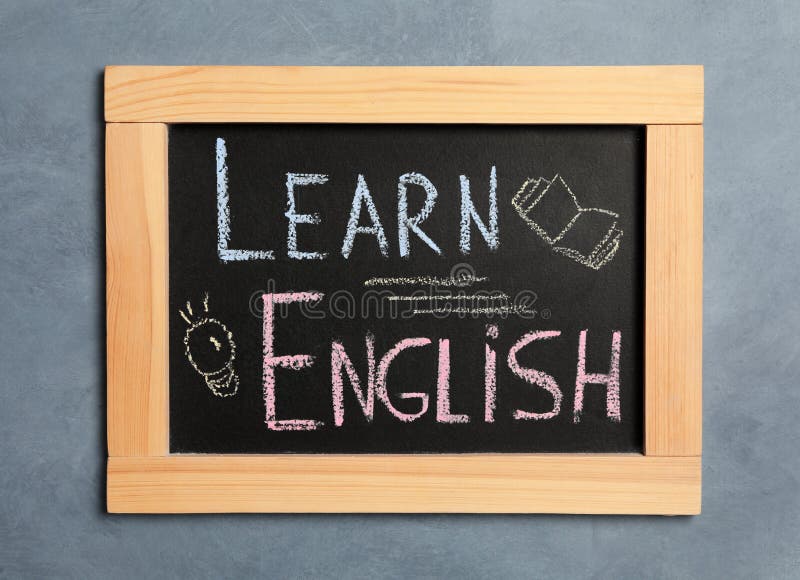 Blackboard with Phrase Learn English on Grey Background, Top View Stock ...