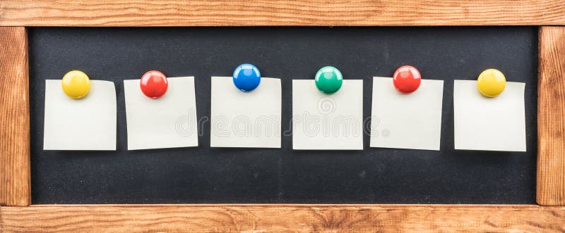 Blackboard and Post-it Notes Stuck with Colorful Magnets Stock Photo ...