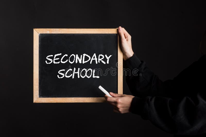 A Blackboard Sign with Secondary School Written on it Stock Image ...