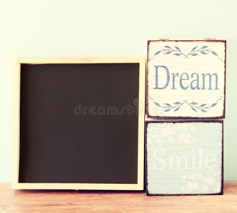 Blackboard and Wooden Boxes Over Wooden Table Stock Photo - Image of ...