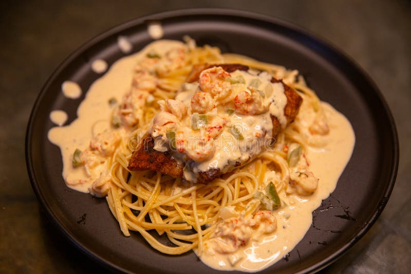 Blackened Snapper with Crawfish Pasta Stock Image - Image of fish ...