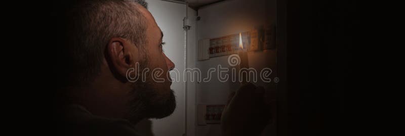 Blackout Concept. Frightened Man with a Candle during Blackout Stock ...