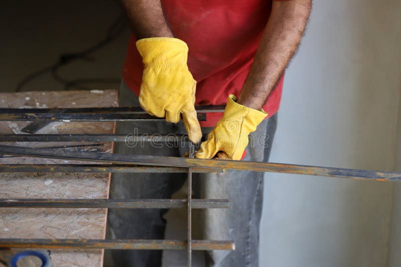 Blacksmith Assembling a Metal Structure for a Fence Stock Photo - Image ...