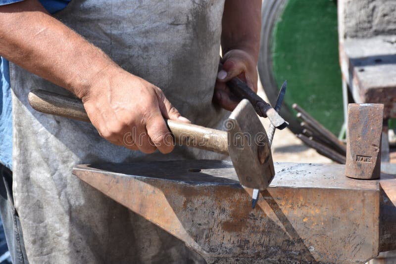 Blacksmith Beating Iron in Old Fashion Stock Image - Image of metal ...