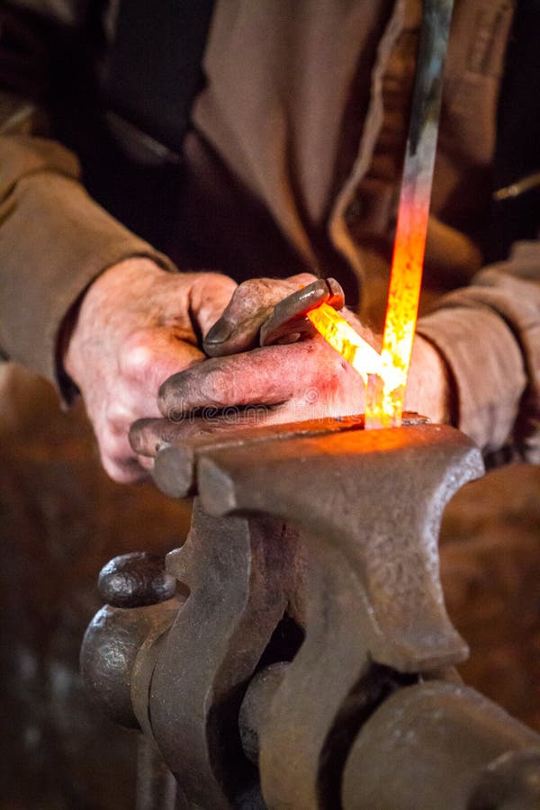 Blacksmith Hammering a Hot Metal Rod Stock Photo - Image of temperature ...