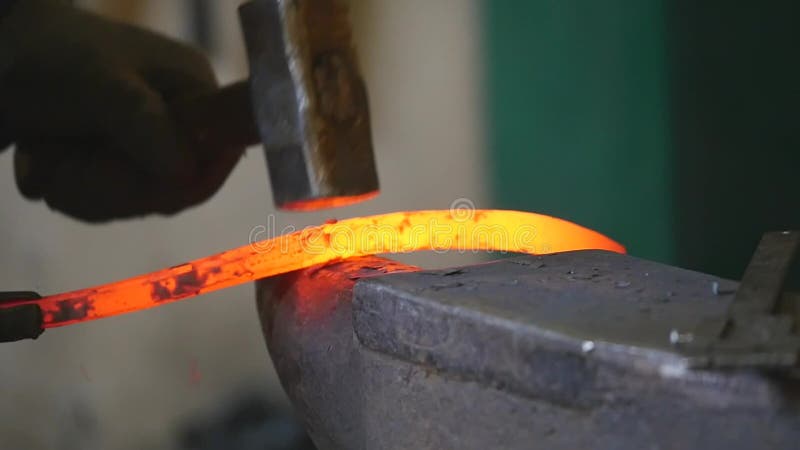 Blacksmith Bends an Iron Hot Stick with a Hammer Stock Video - Video of ...