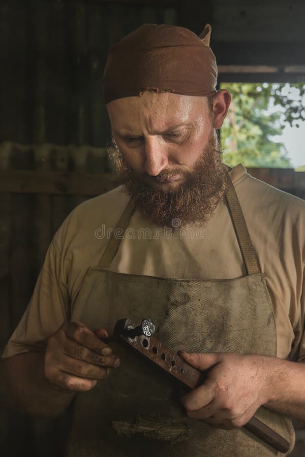 Blacksmith Checks the Dimensions of a Forged Part Using a Template ...