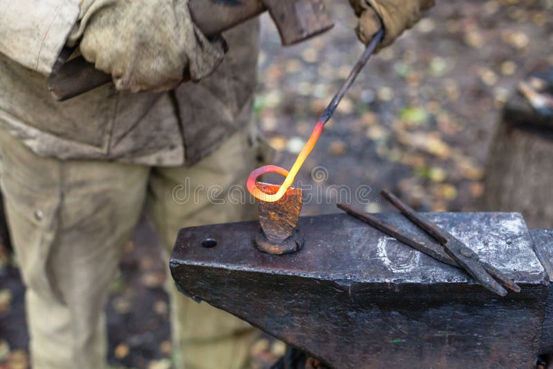 Blacksmith Cut Out a Buckle with Hammer and Chisel Stock Photo - Image ...