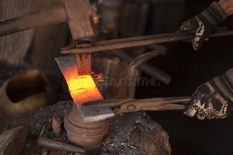 Blacksmith Cutting a Piece of Metal Stock Image - Image of asia ...