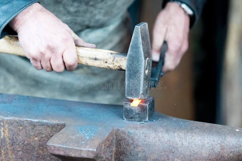 Blacksmith Doing Smithing in an Open Forge Stock Photo - Image of fire ...