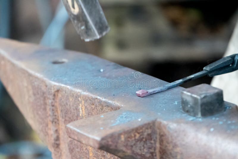 Blacksmith Doing Smithing in an Open Forge Stock Photo - Image of ...