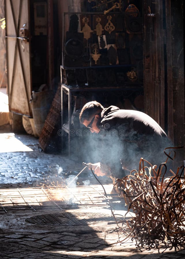 Blacksmith with Face Obscured Works in Souk Haddadine, the Blacksmith S ...