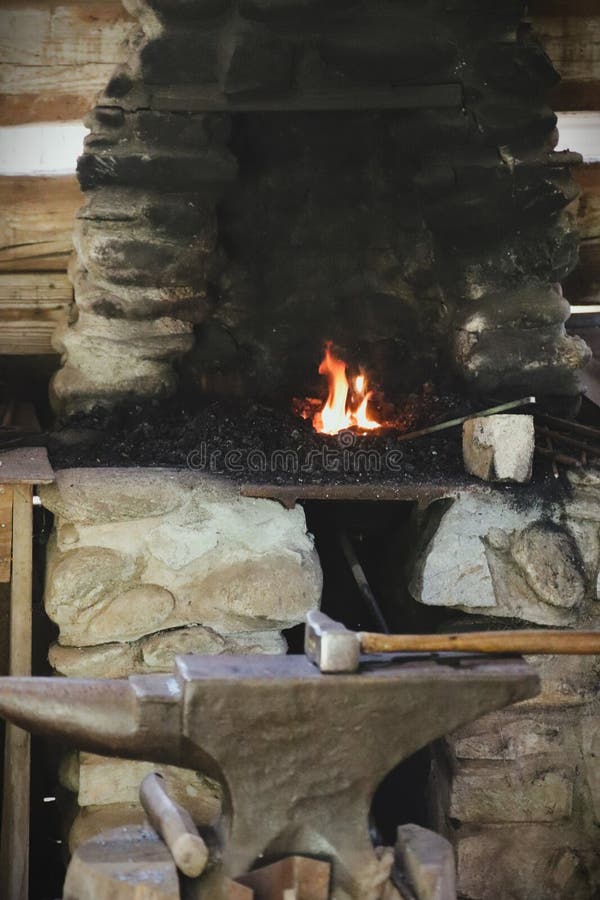 Blacksmith Forge with Coal, Fire, Bricks, Anvil, and Hammer Stock Photo ...
