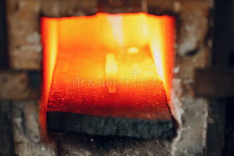 Blacksmith Forge Oven with Hot Flame. Smith Heating Iron Piece of Steel ...