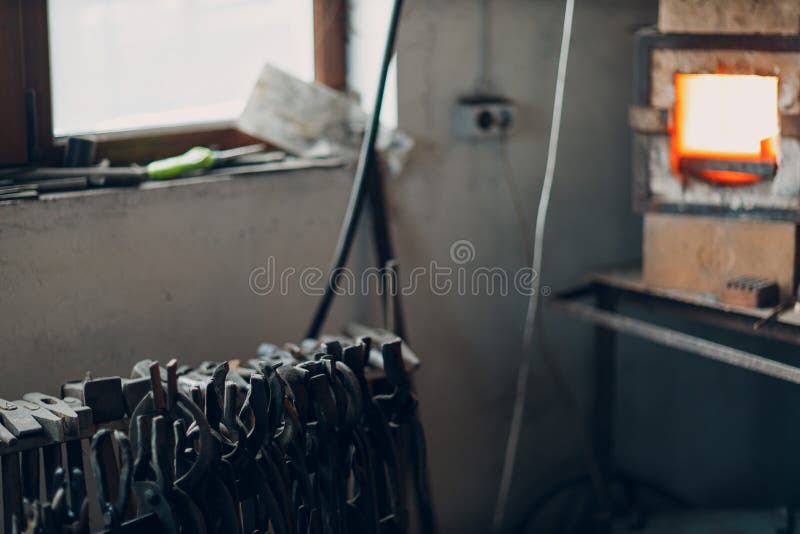 Blacksmith Forge Oven with Hot Flame. Smith Heating Iron Piece of Steel ...