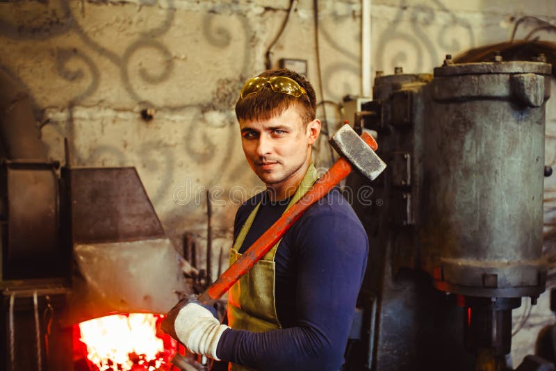 The Blacksmith is at the Forge Stock Image - Image of molten, craftsman ...