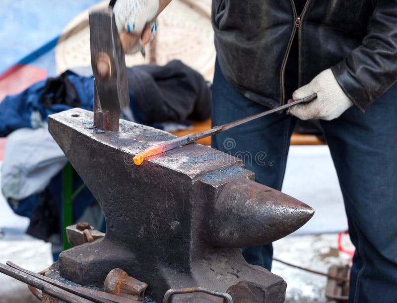 Blacksmith Forges a Red-hot Iron Stock Image - Image of anvil, manual ...