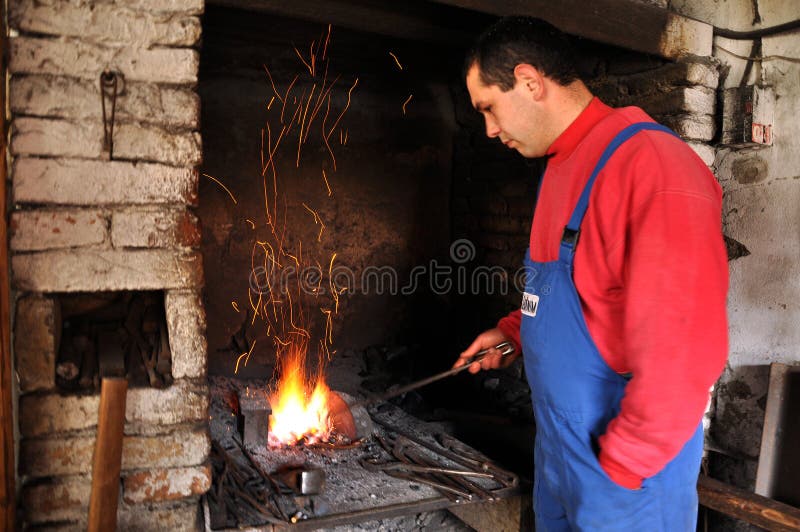 Blacksmith Forges Item on the Anvil. Editorial Photography - Image of ...