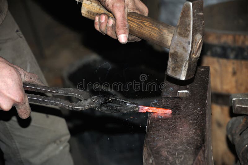Blacksmith Forges a Red-hot Metal Hammer Stock Image - Image of glowing ...