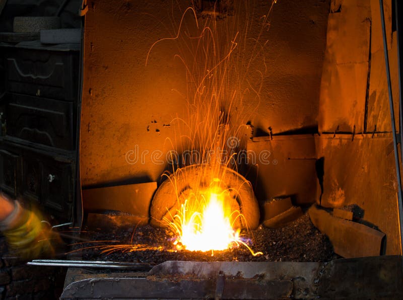 Blacksmith Forging Iron in Workshop Stock Photo - Image of material ...