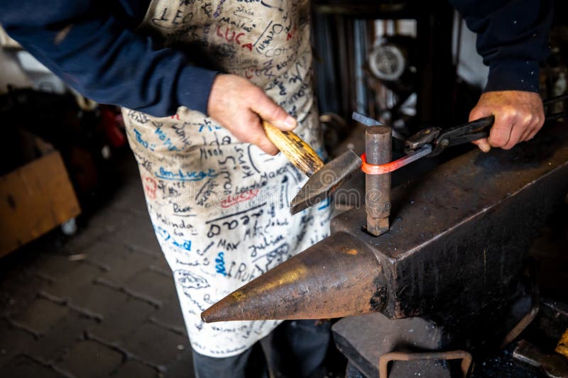 Blacksmith Forging Metal on Anvil with Hammer and Tongs Stock Image ...
