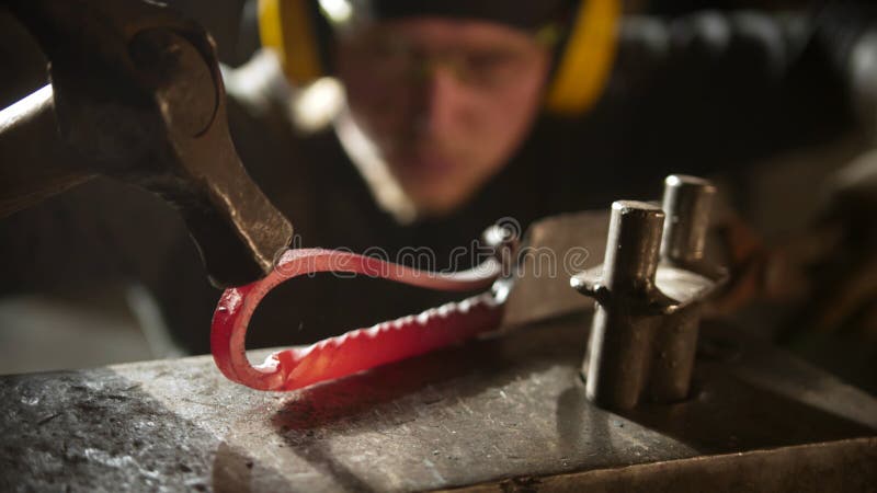 Blacksmith Forging a Knife Blade in Workshop Using a Hammer Stock Photo ...