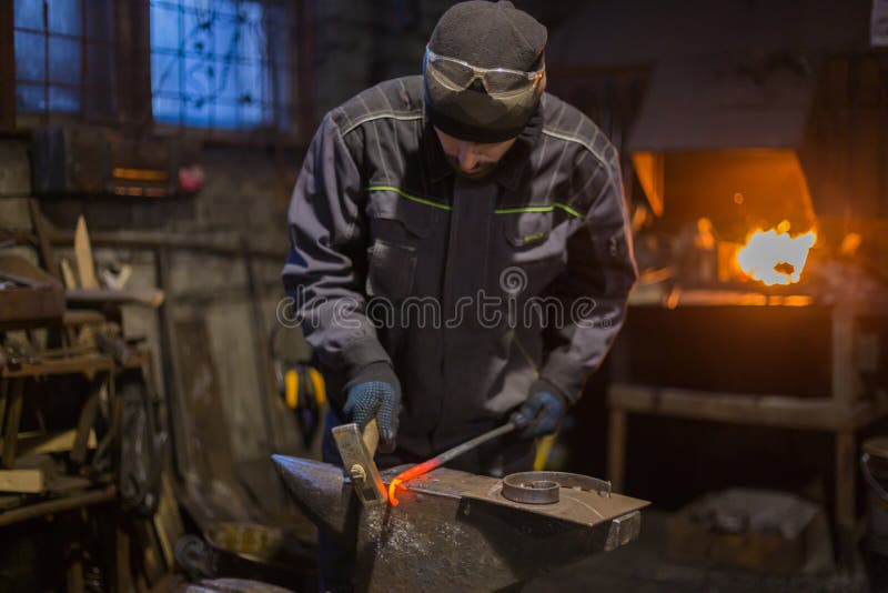 Blacksmith Forging Molten Metal Stock Photo - Image of skill ...