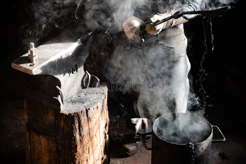 Blacksmith Forging Process - Cooling Out an Item in the Bucket of Cool ...