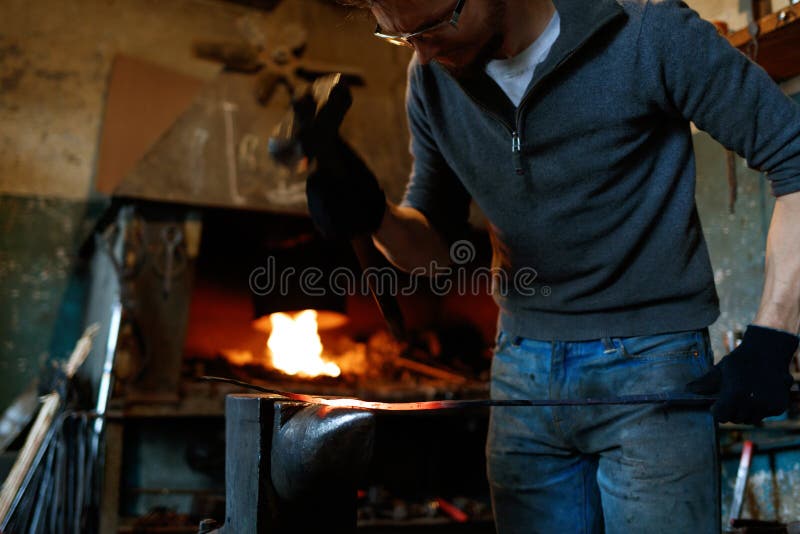 Blacksmith Forging Red-hot Metal with Hammer. Stock Photo - Image of ...