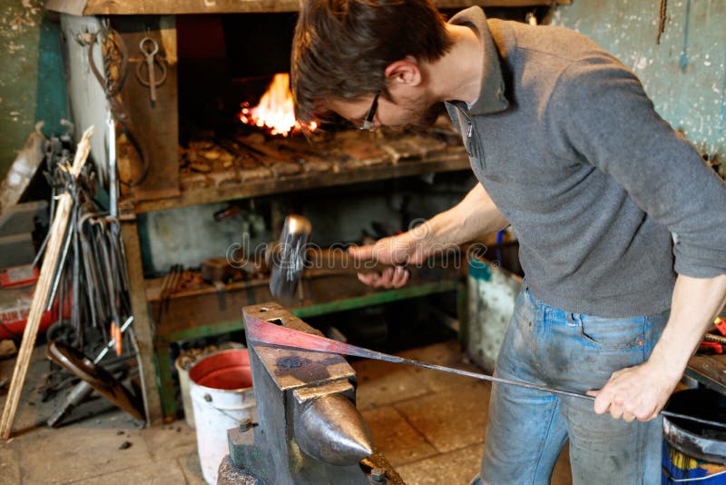 Blacksmith Forging Red-hot Metal with Hammer. Stock Image - Image of ...