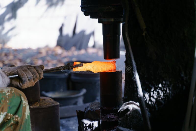 The Blacksmith is Forging Very Hot Iron To Make Various Tools Stock ...